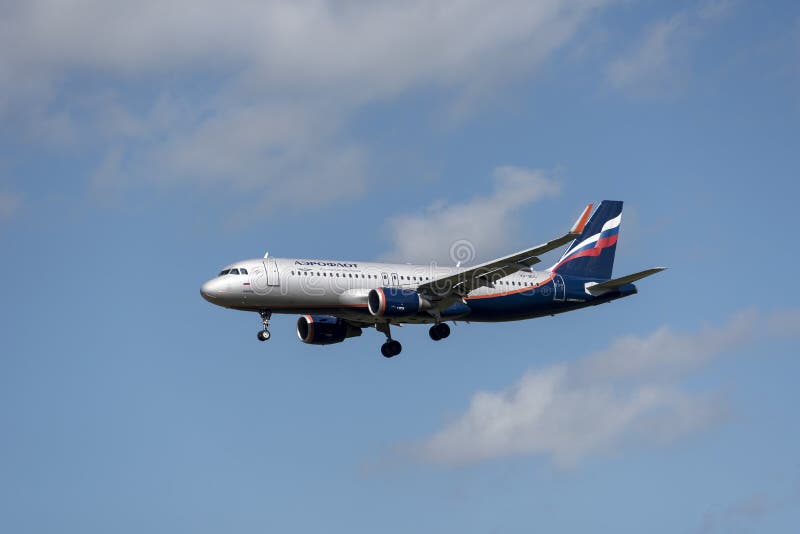 Airbus A320 in the Cloudy Sky Editorial Stock Photo - Image of airliner ...