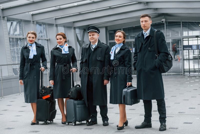 Aircraft Crew in Work Uniform is Together Outdoors in the Airport Stock ...