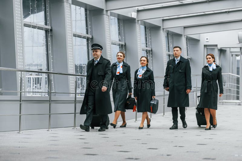 Aircraft Crew in Work Uniform is Together Outdoors in the Airport Stock ...