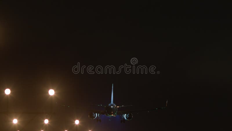 Aircraft landing at night stock video. Video of operation - 313436611