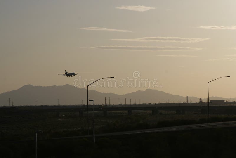 Aircraft Landing in Sunset - Phoenix, Arizona Stock Photo - Image of ...