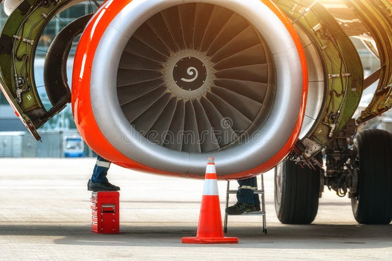 Aircraft Maintenance Mechanics Inspecting and Working on Airplane Jet ...