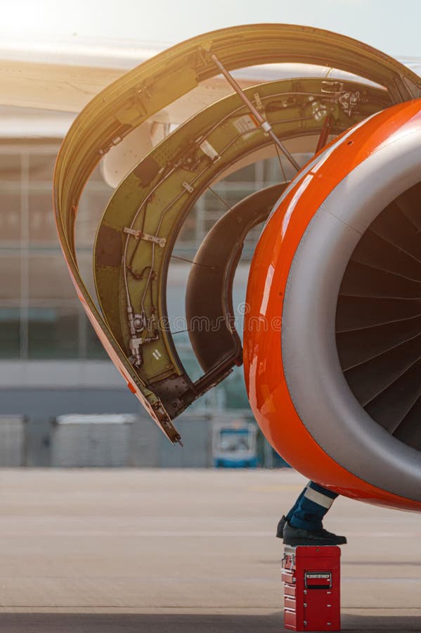 Aircraft Maintenance Mechanics Inspecting and Working on Airplane Jet ...