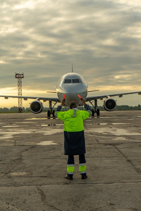 Aircraft Maintenance Worker Standing in Front of the Airplane at the ...