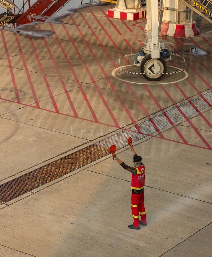 Aircraft Marshaller editorial stock photo. Image of stripes - 320546848
