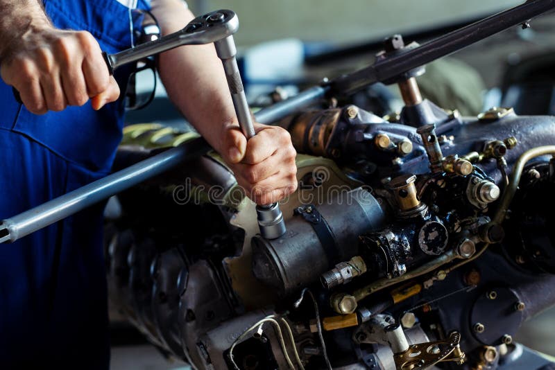 Aircraft Mechanic Repairing Jet Engine Stock Photo - Image of assembly ...