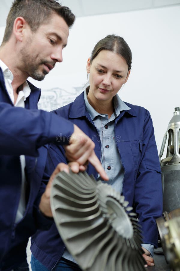Aircraft mechanics at work stock image. Image of motor - 254757119