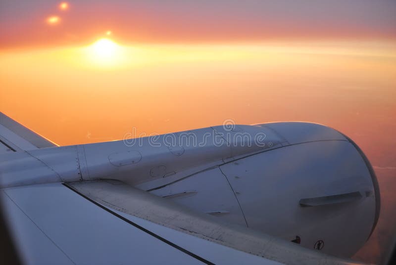 Aircraft over sunset sky stock photo. Image of high, evening - 12153796