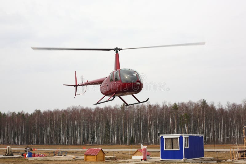 Aircraft - Red Small Helicopter Makes Flight at Low Height Stock Image ...