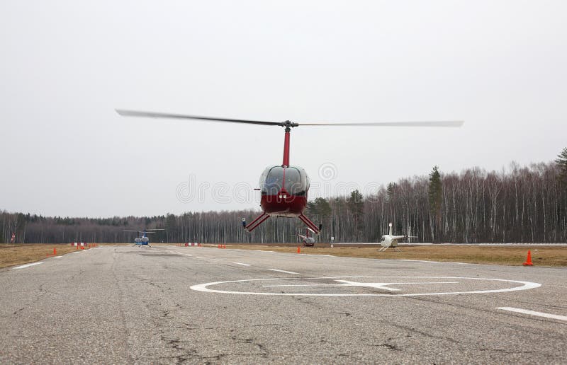Aircraft - Red Small Helicopter Makes Flight at Low Height Stock Photo ...