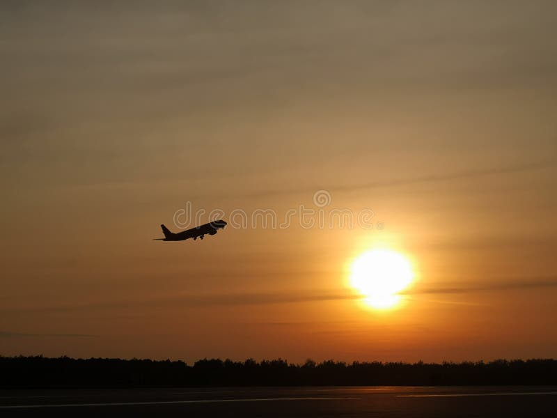 Aircraft in the sunset stock photo. Image of airport - 38277474