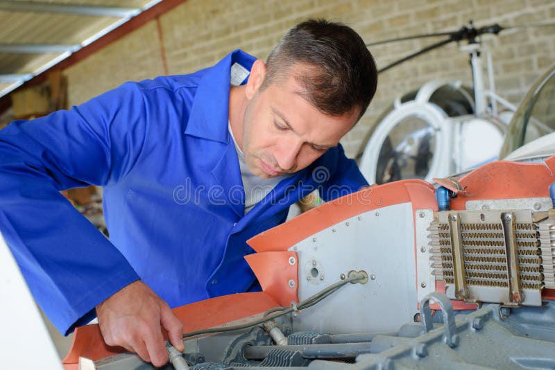 Aircraft Technician at Work Stock Image - Image of standard, mending ...