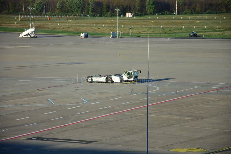 Aircraft Tug on an Airport with Ground Marker Editorial Photography ...