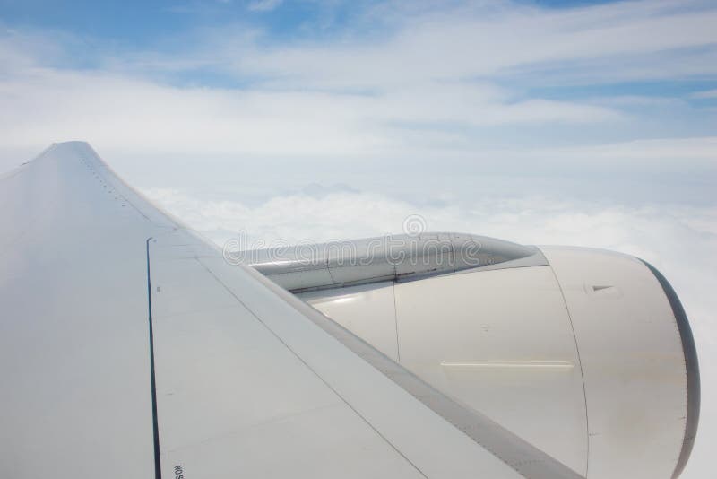 Passenger View through the Window of a Jet Plane Showing Sky, Clouds ...