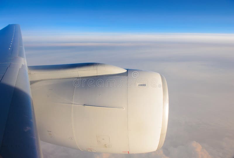 Passenger View through the Window of a Jet Plane Showing Sky, Clouds ...