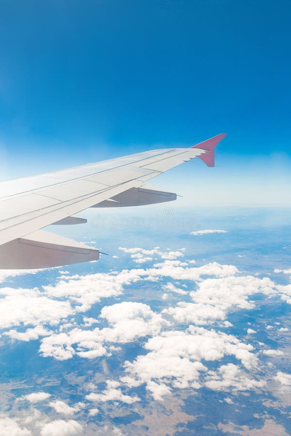 Aircraft Wing on the Clouds, Flies on the Mountains Background Stock ...