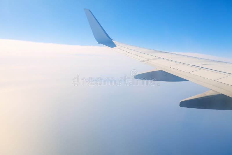 Aircraft wing in flight stock image. Image of transportation - 276717873