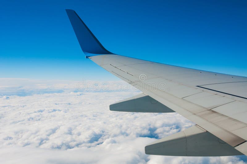 Aircraft Wing Over the Clouds Stock Image - Image of vacation, clouds ...