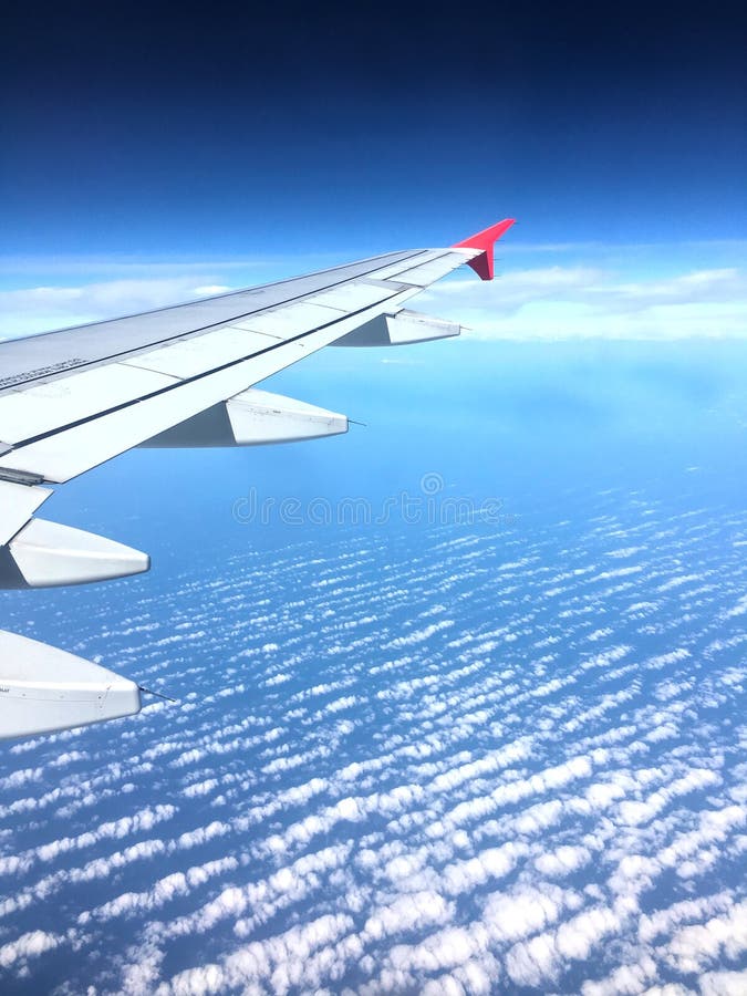 Aircraft Wing Over Marshmallow Clouds Stock Image - Image of clouds ...