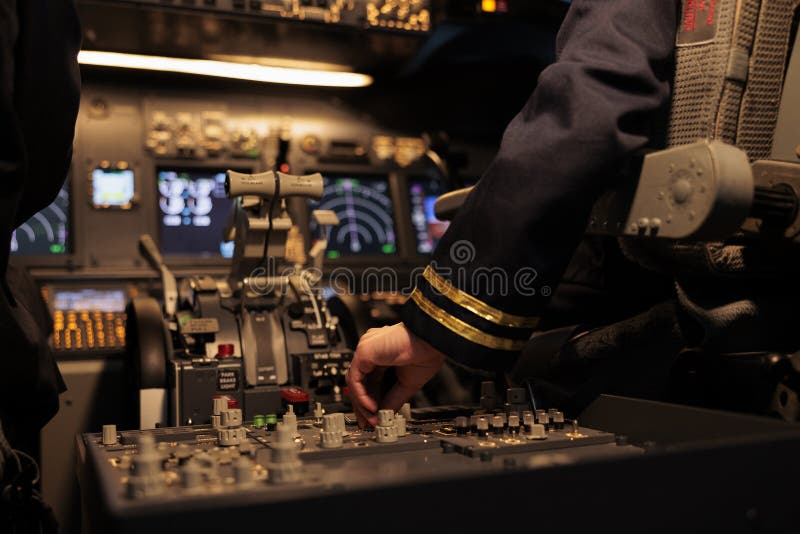 Aircrew Member Using Control Panel Command on Dashboard Stock Photo ...