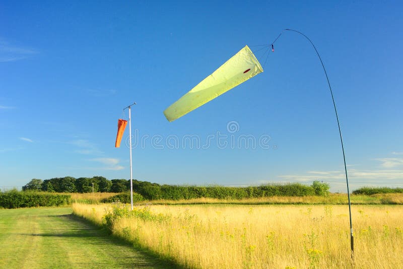 Windsock on grass runway stock photo. Image of runway - 5426536