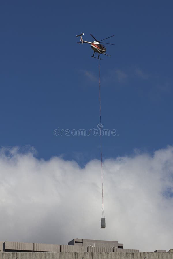 Helicopter Airlifting Workmen From Power Line Stock Photo - Image of ...