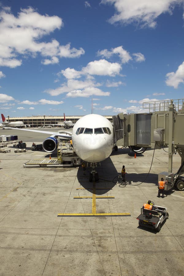 Airline Jet in Terminal at Airport Stock Photo - Image of angle, color ...