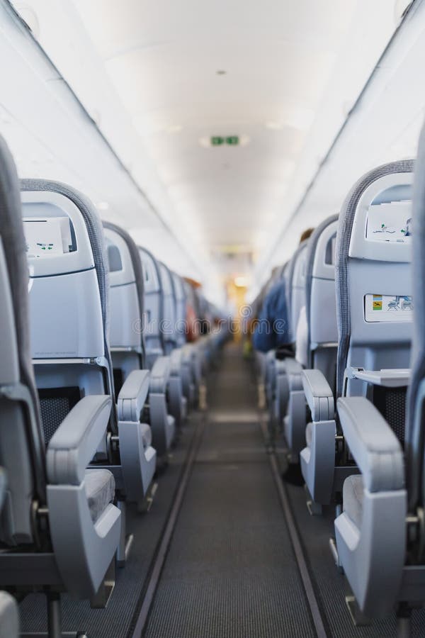 Airline Passenger Seats and Aisle in Airplane Stock Photo - Image of ...