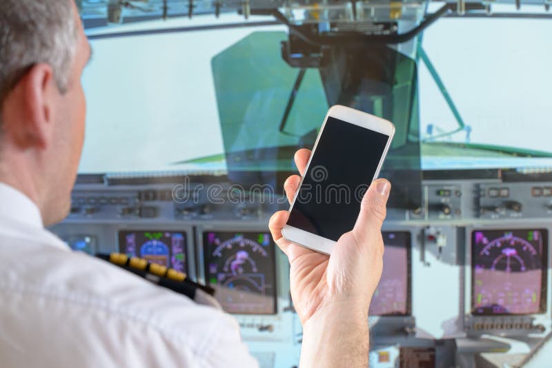 Airline Pilot Using Smart Phone Stock Image - Image of aviator, aircrew ...