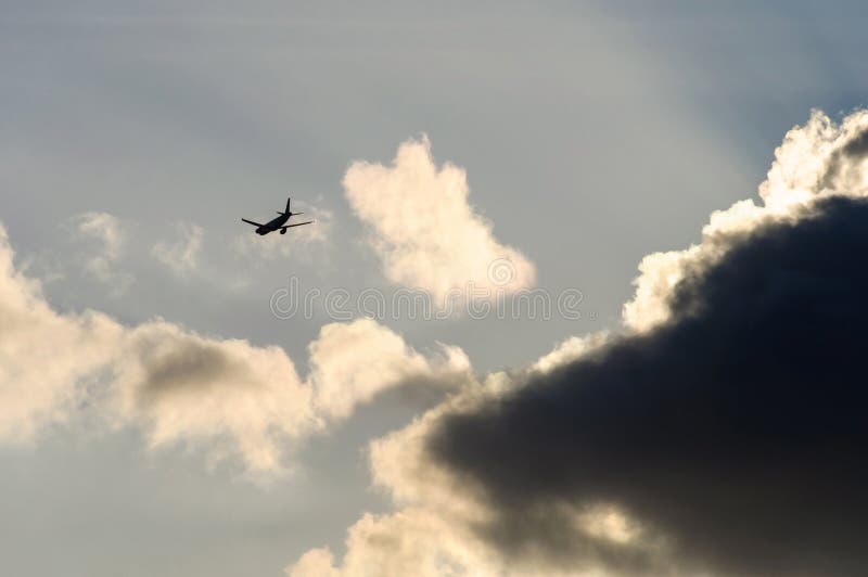 Airliner Flying in the Evening Light Stock Photo - Image of ...