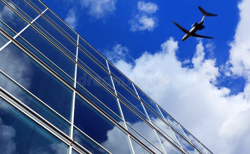 Airliner Flying Over Office Buildings Stock Image - Image of travel ...
