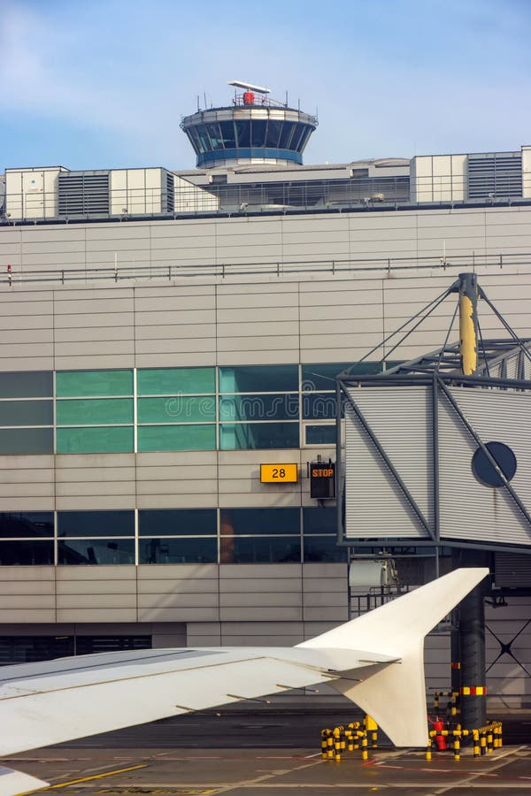 Airliner Wing Under the Airport Building with Control Tower Stock Image ...