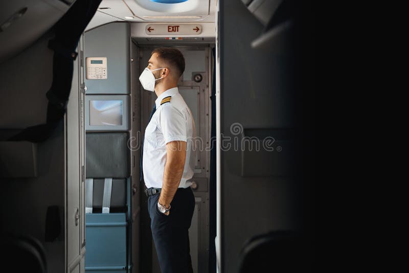 Handsome Pilot Standing on Airstairs To Plane Stock Image - Image of ...