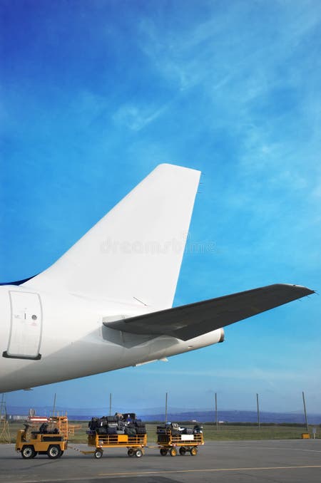 Airplain Tale and Luggage Cart Stock Image - Image of bogie, suitcase ...