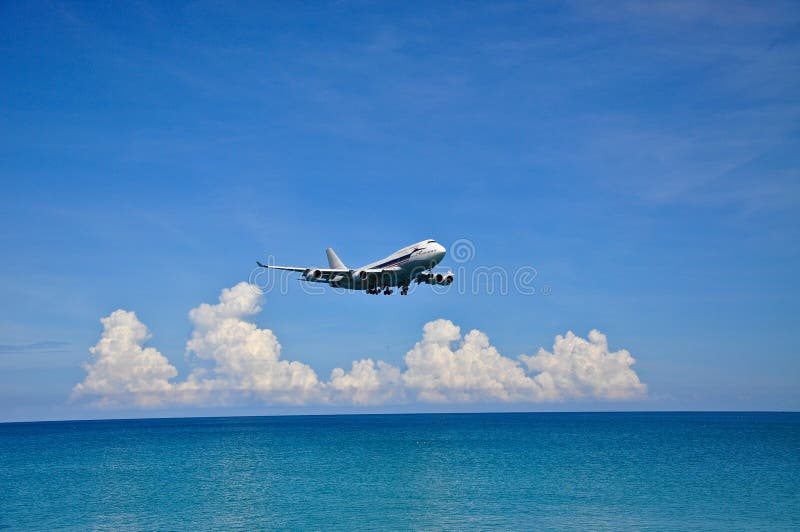 Airplane Landing over Sea stock photo. Image of calm - 24331146