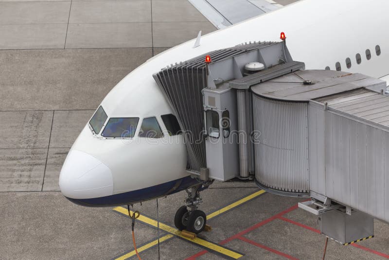 Airplane at an Airport Gate Stock Photo - Image of security ...
