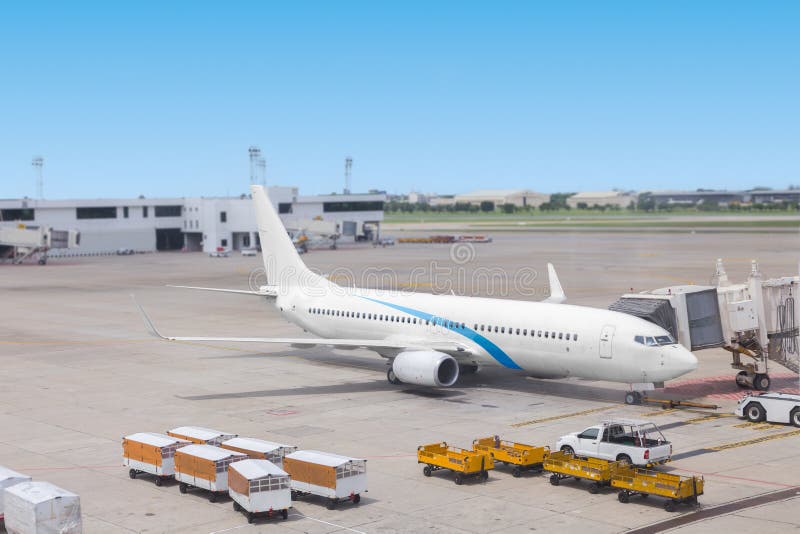 Airplane at airport gate stock photo. Image of aviation - 102588464