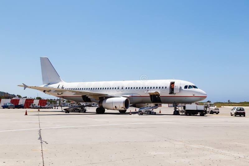 Airplane in Airport Serviced by the Ground Crew Stock Image - Image of ...