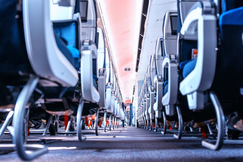 Airplane aisle stock photo. Image of person, aisle, indoors - 165633218
