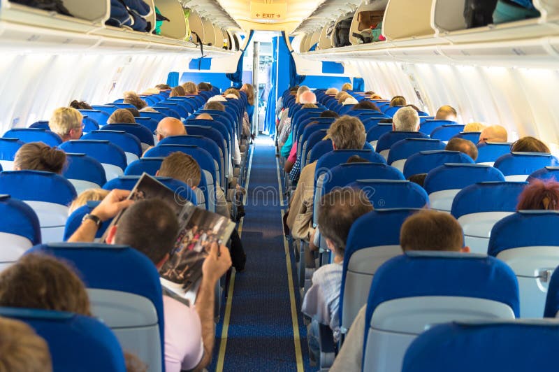 Airplane Aisle with Rear View of Passengers Editorial Image - Image of ...