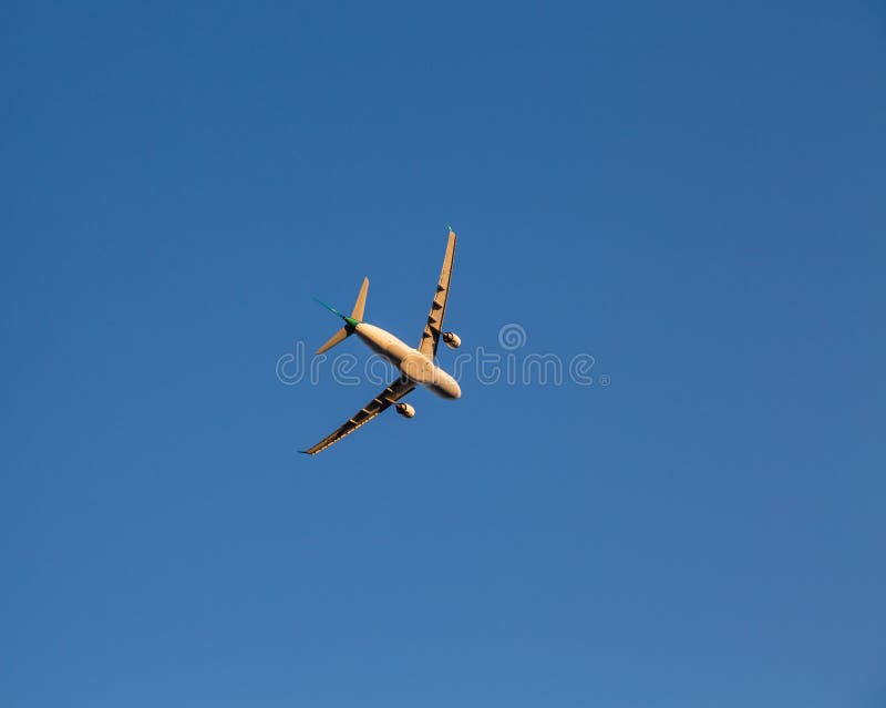 Airplane Banking for a Turn Against a Blue Sky Stock Image - Image of ...