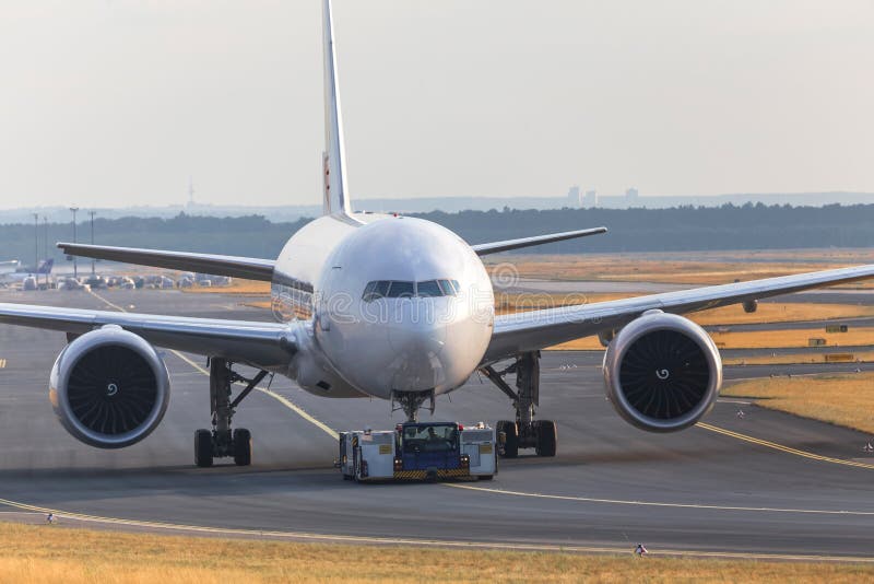 Airplane Beeing Towed with a Modern Towing Vehicle Stock Image - Image ...