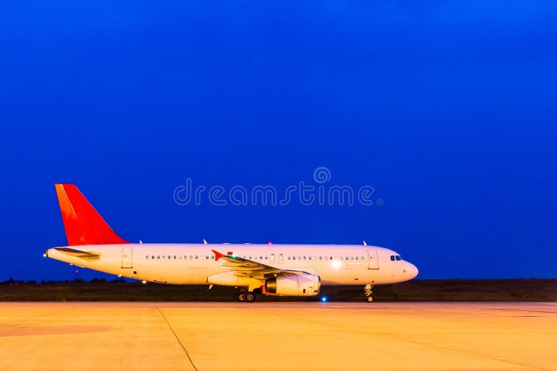 Airplane in blue hour stock photo. Image of departure - 43942140