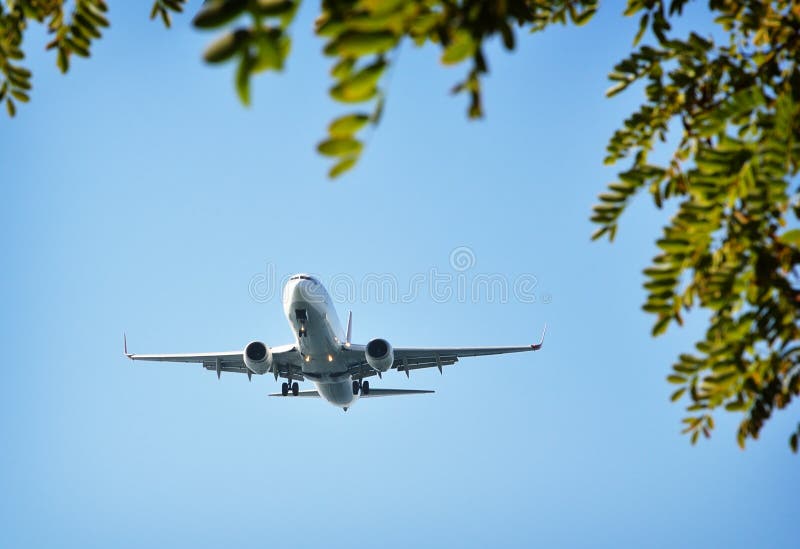 Airplane in blue sky stock image. Image of aircraft - 133196173