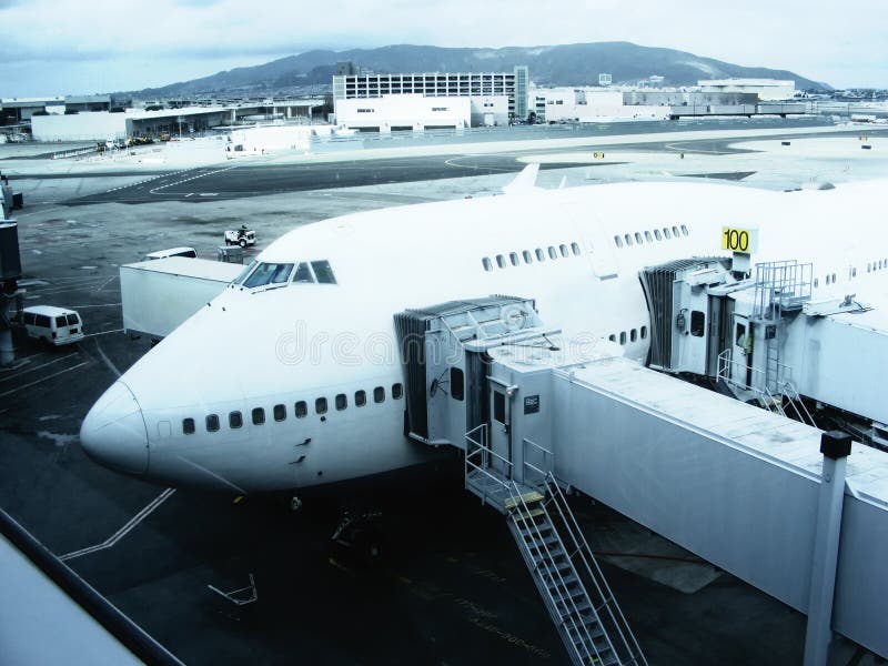 Airplane Boeing 747 at Terminal Stock Image - Image of plane, mountains ...
