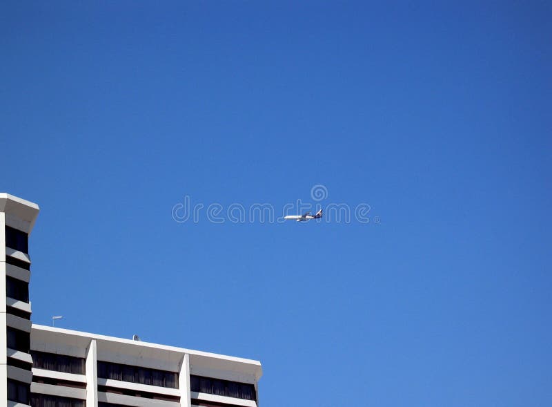 Airplane and building stock image. Image of overhead, airplane - 2692547