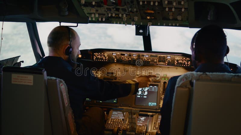 Airplane Captain and Copilot Looking at Radar Compass on Dashboard ...