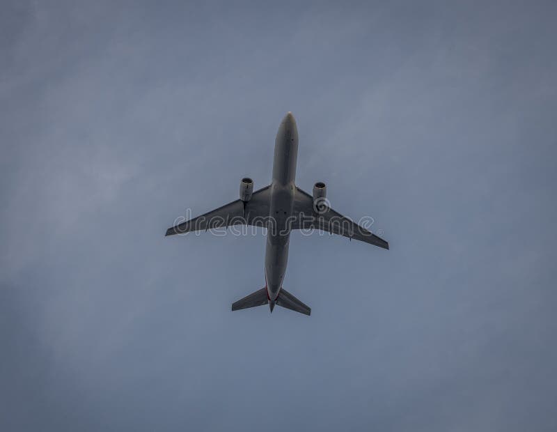 Airplane in clear blue sky stock image. Image of commercial - 347916579