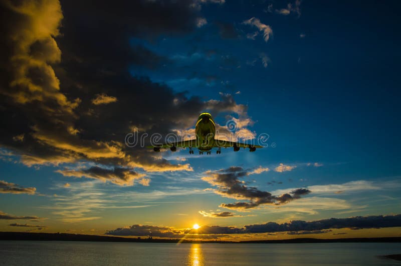 The Airplane Climbs, Flying Over the Sea Towards the Sun at Sunset ...