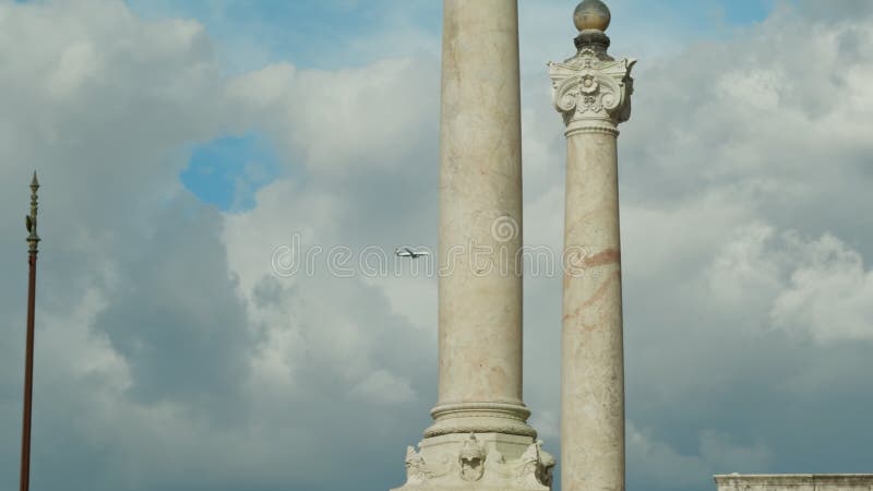 Airplane in the Clouds Flying between the Columns of Rome Stock Footage ...